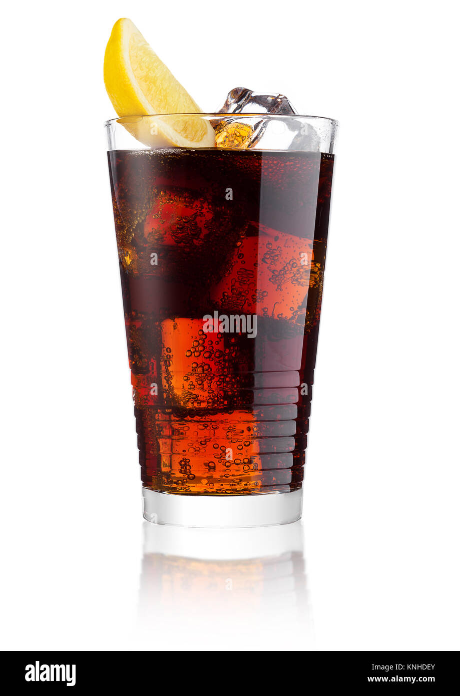 Glass of cold cola soda drink with lime and lemon on white background ...