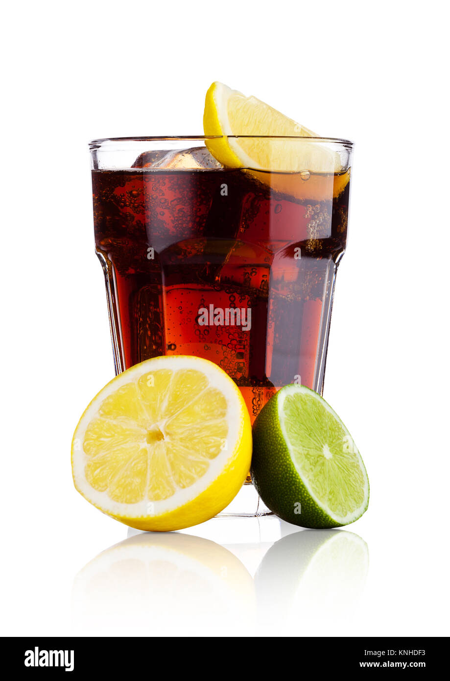 Glass of cold cola soda drink with lime and lemon on white background ...