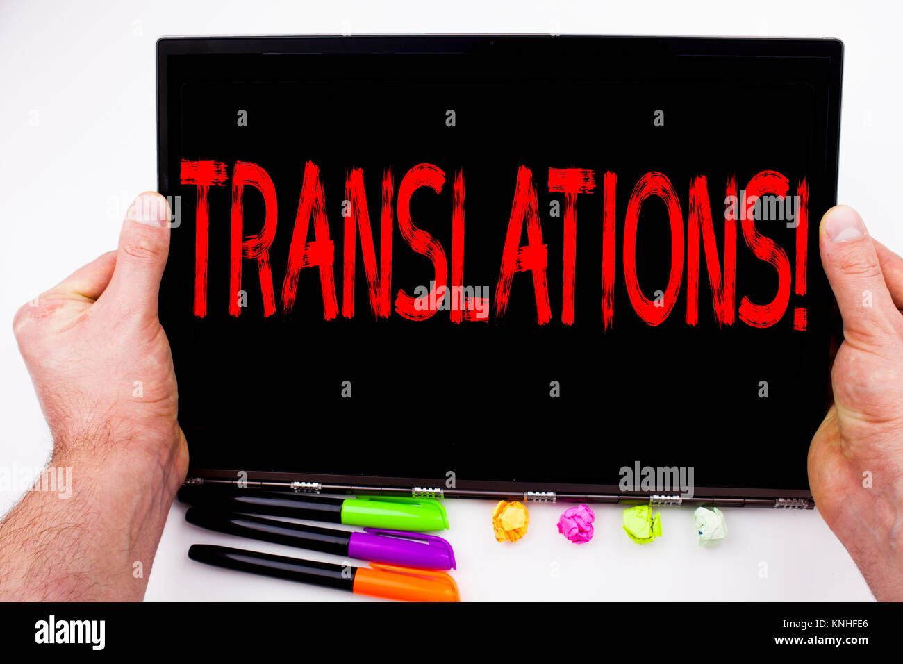 Translations text written on tablet, computer in the office with marker ...