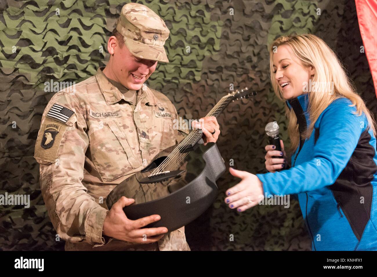 Country music singer Kellie Pickler gives her guitar to a U.S. soldier ...
