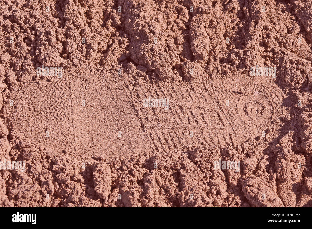 Shoe print in colored sand Stock Photo - Alamy