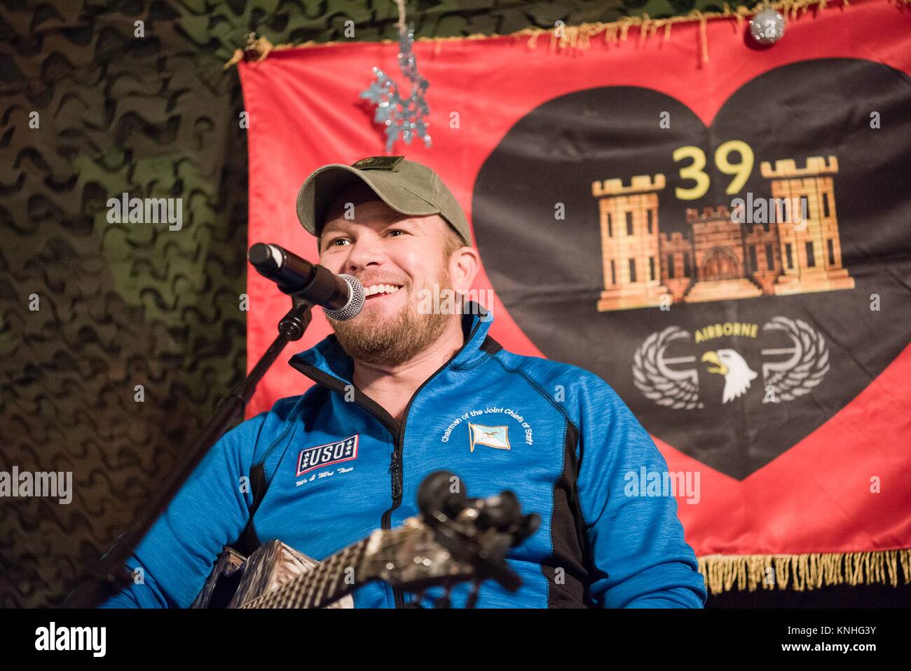 Country music singer Kyle Jacobs performs for U.S. troops during the ...