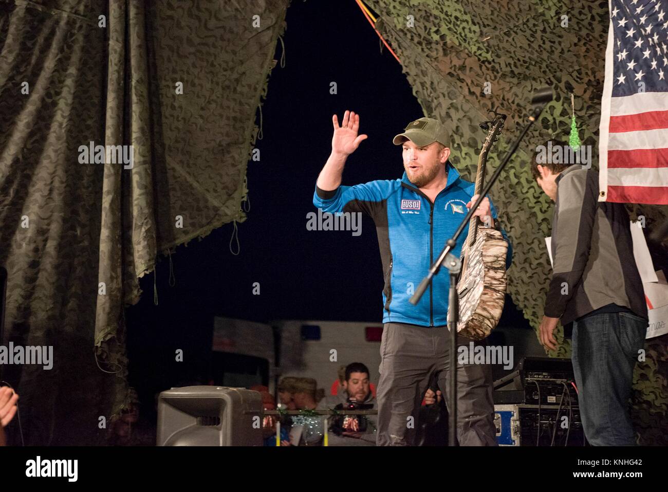Country music singer Kyle Jacobs performs for U.S. troops during the ...