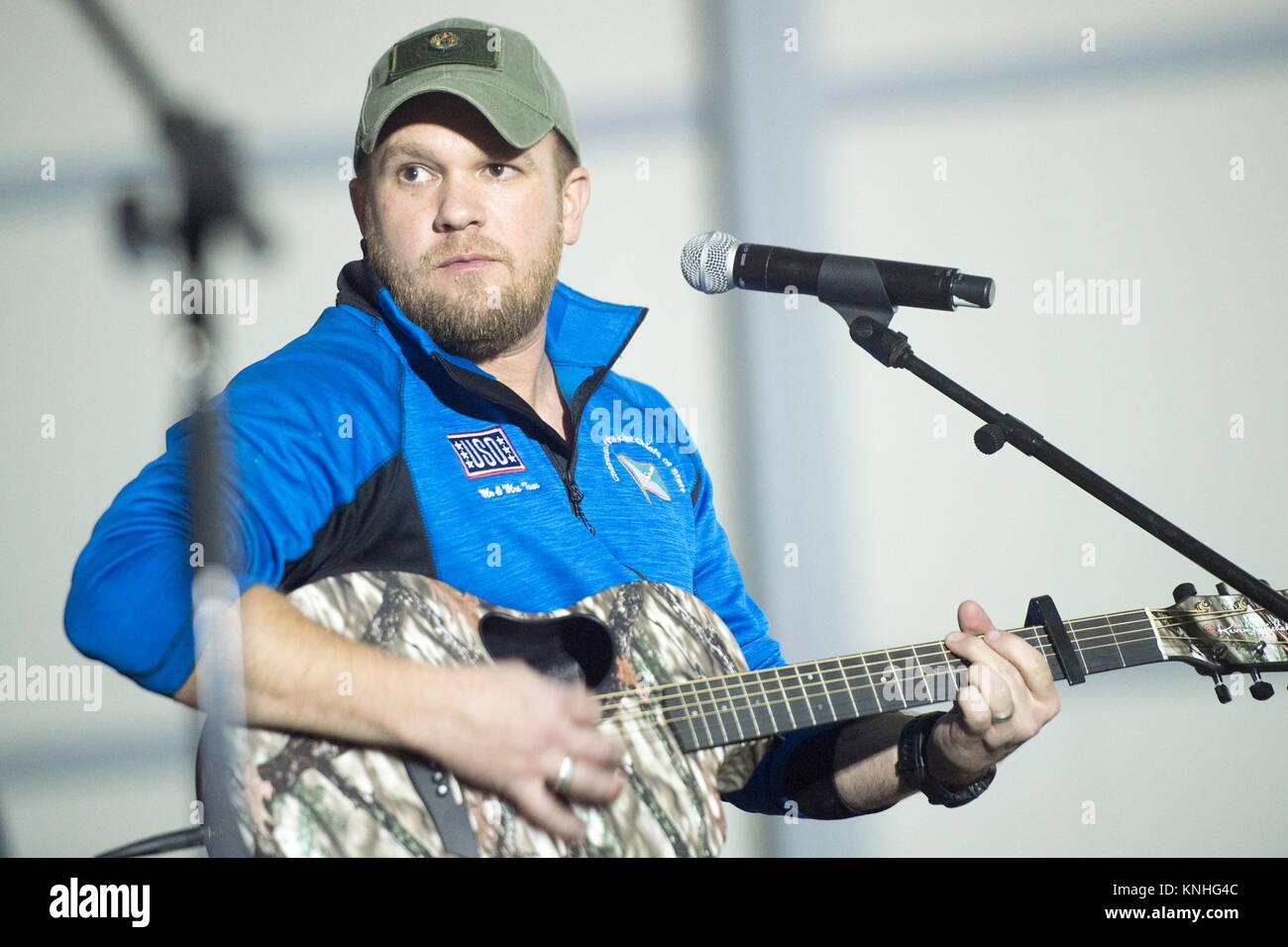 Country music singer Kyle Jacobs performs for U.S. troops during the ...