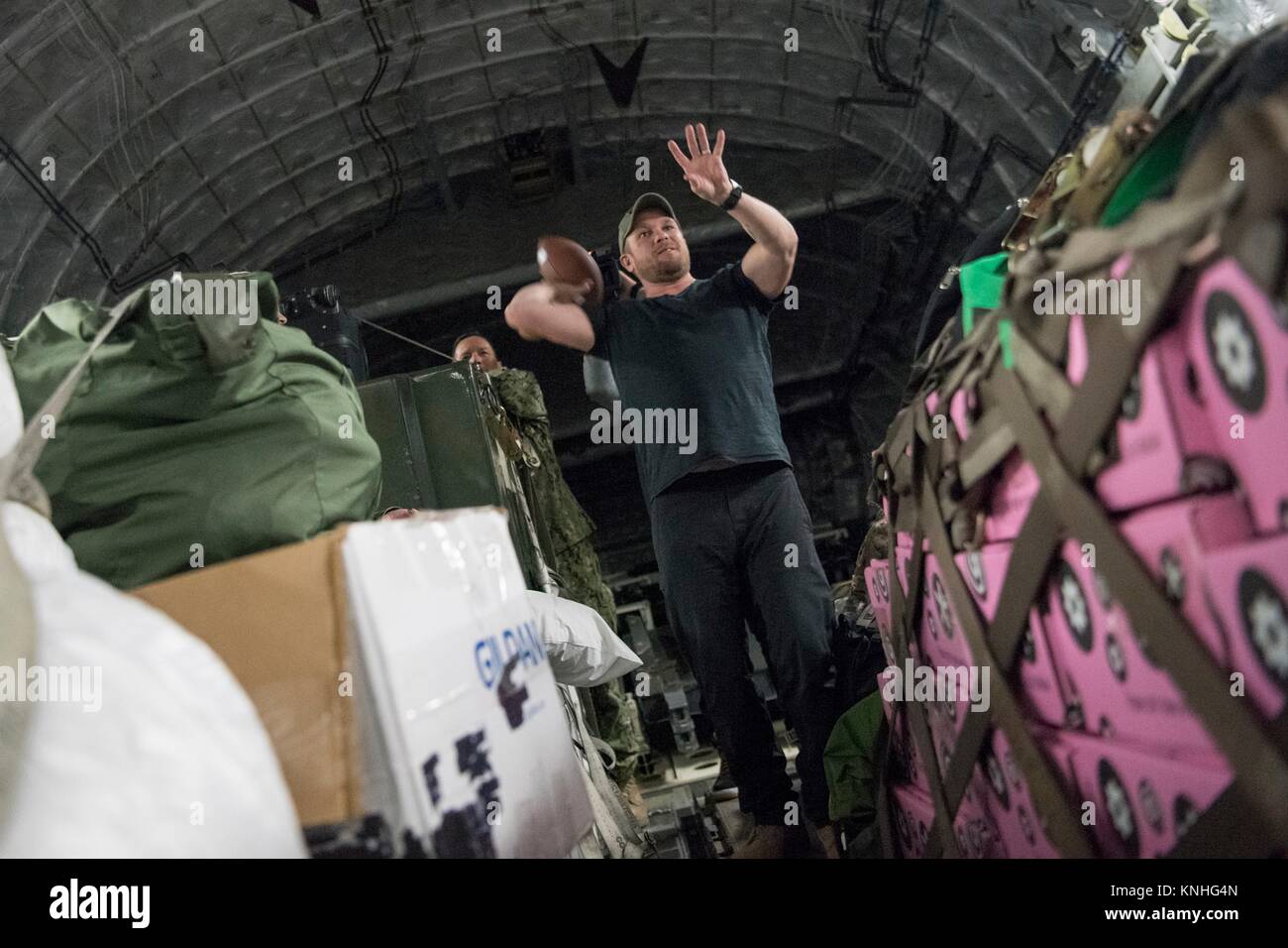 Country music songwriter Kyle Jacobs tosses a football on the plane en ...