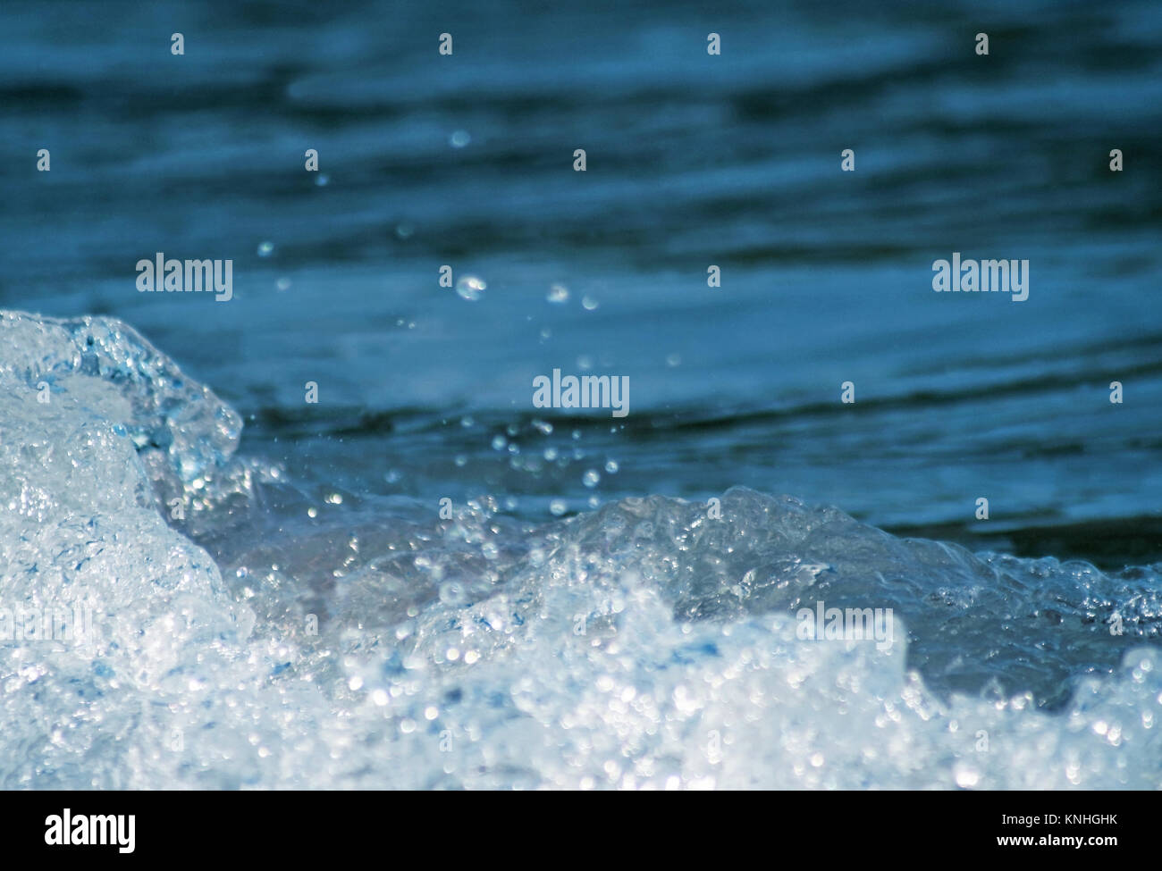 Aqua blue waters with wave splash Stock Photo - Alamy