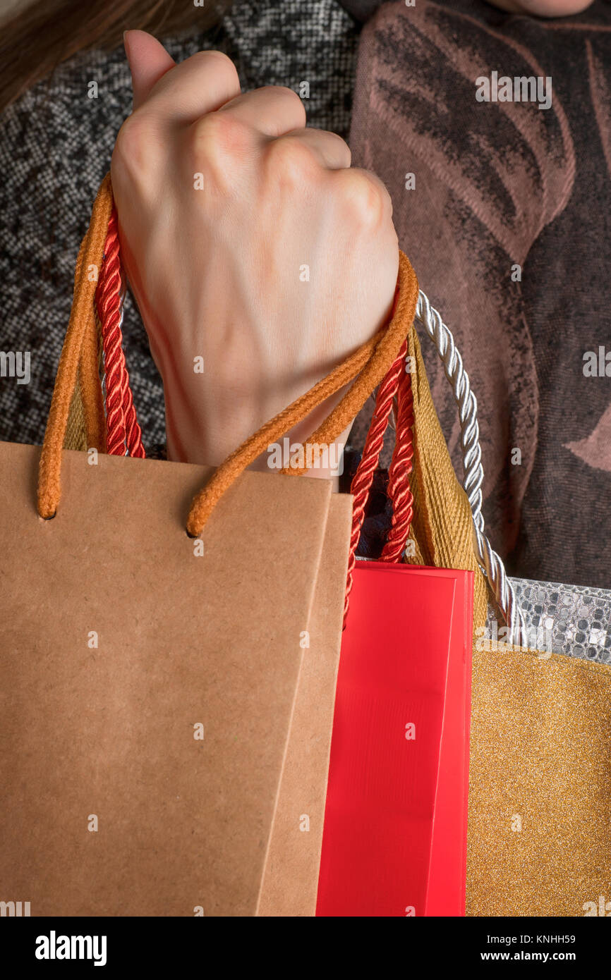 Hand holding shopping bags hi-res stock photography and images - Alamy