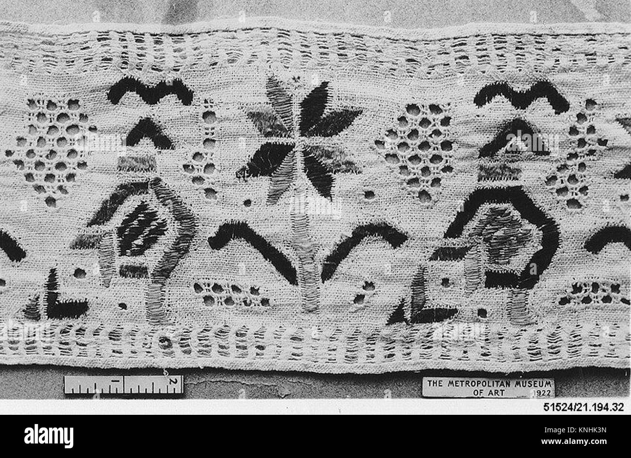 This band, likely a piece of decorative or functional textile, reflects ...