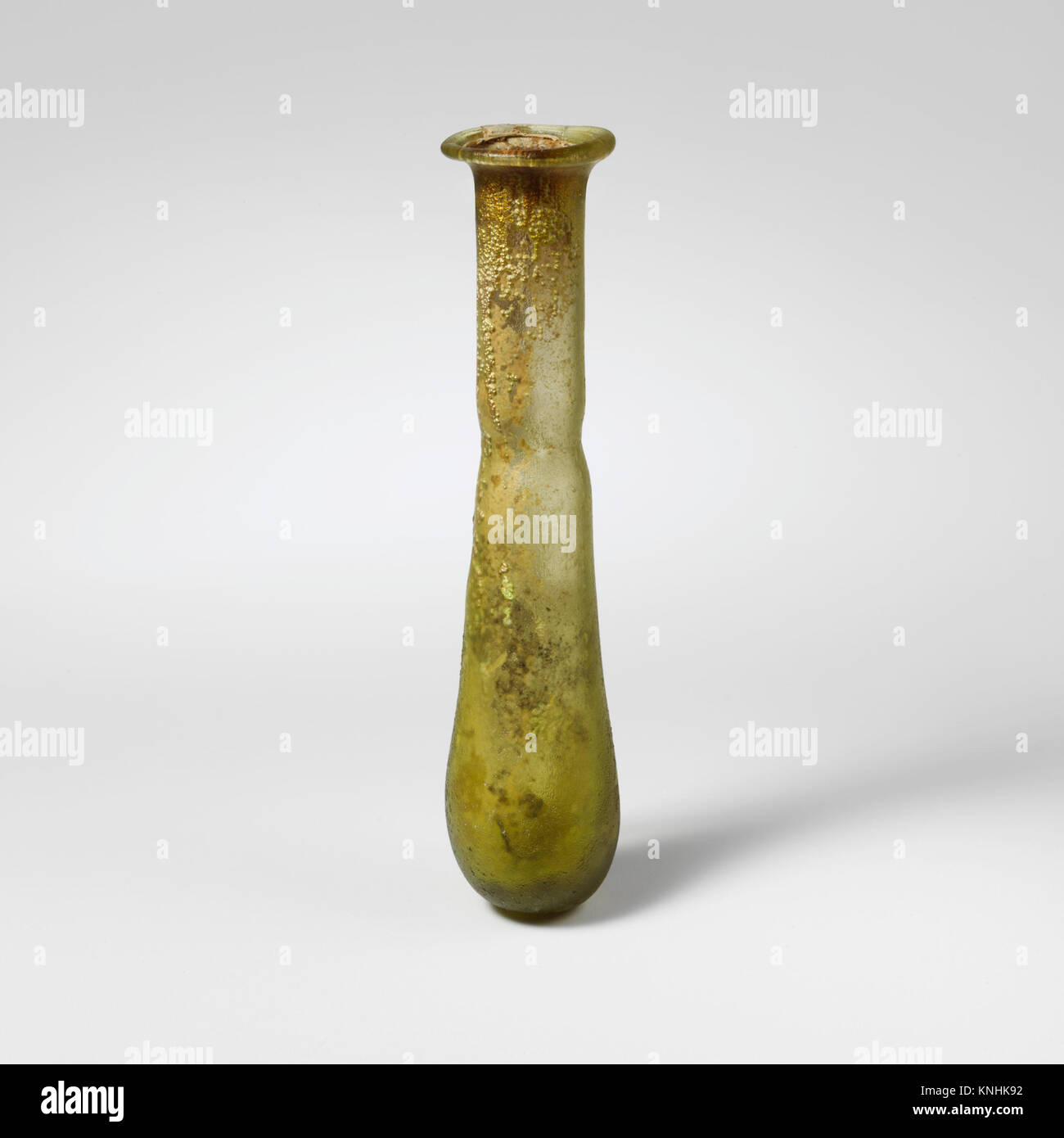 This glass perfume bottle is a delicate object crafted for storing ...