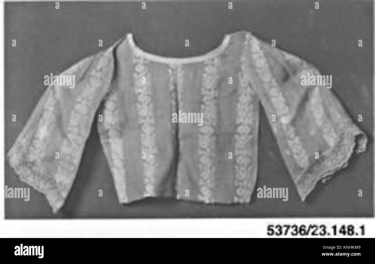 This blouse, also known as 'Camisa,' is an example of historical ...