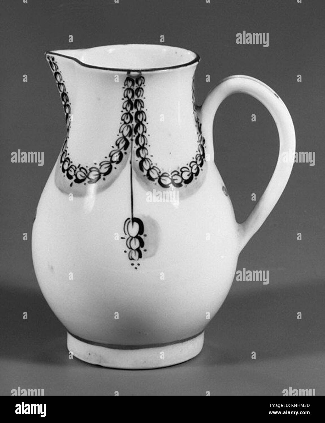 A cream pitcher, part of a larger service, crafted from fine material ...