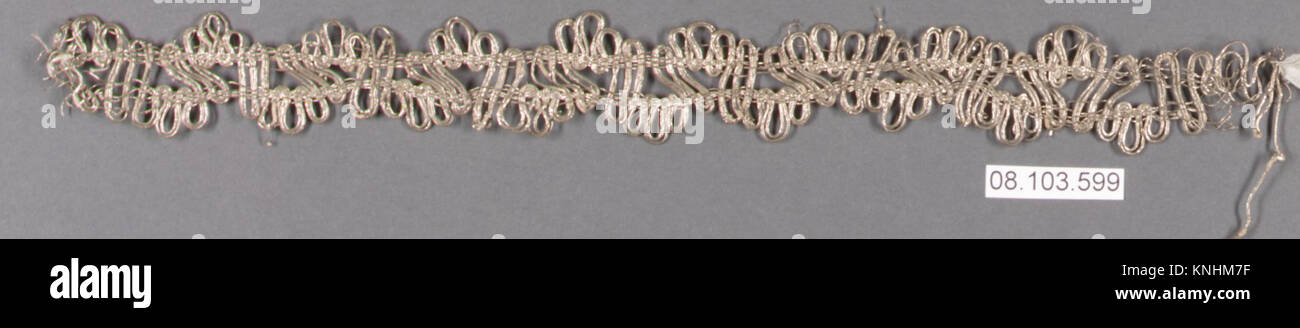This galloon, a type of narrow decorative trim, showcases detailed ...