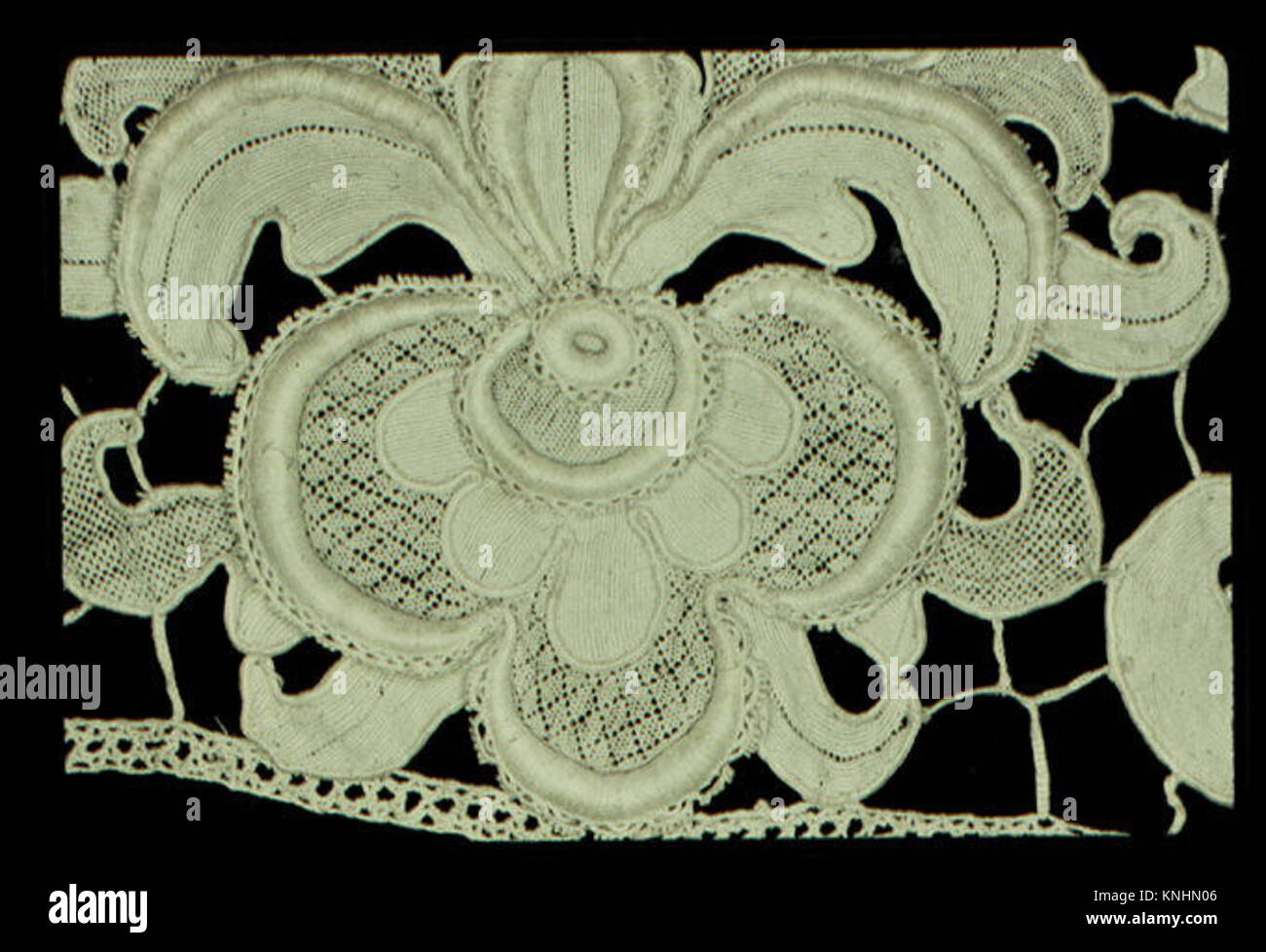 This flounce fragment is a delicate piece of fabric featuring intricate ...