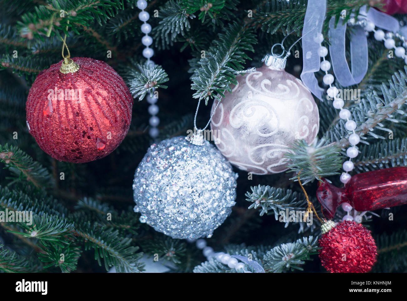 A festive mood with beautifully decorated Christas tree. White, silver ...