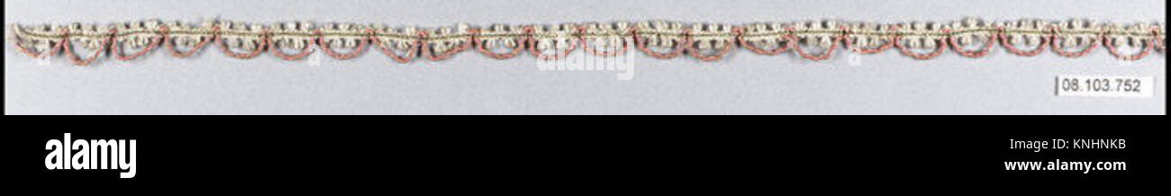This gimp, a decorative trim often used in garment making, represents ...