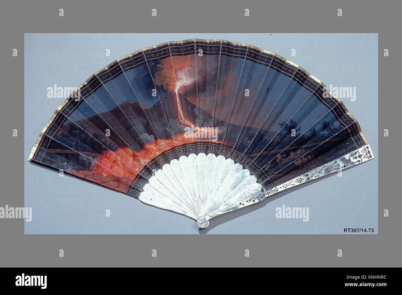 This intricately designed fan features elaborate decorative elements ...