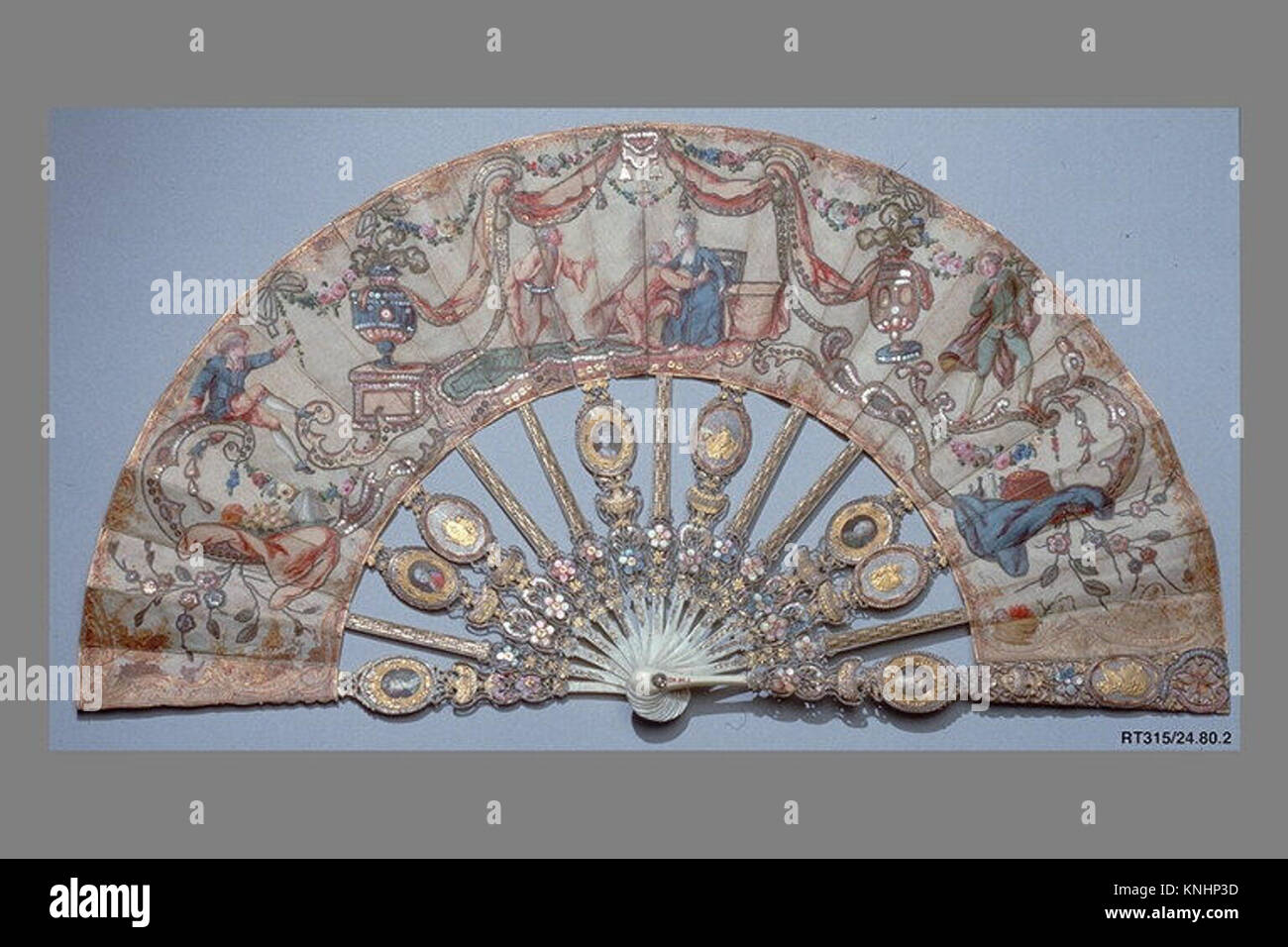 This folding fan, a decorative and functional accessory, features a ...