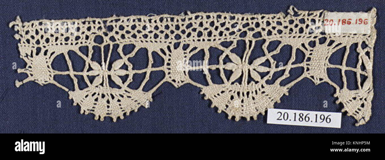 A decorative edging, likely part of a larger textile or furniture piece ...