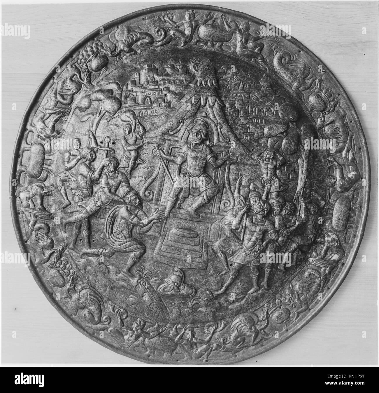 This embossed shield is a historical artifact, showcasing intricate ...