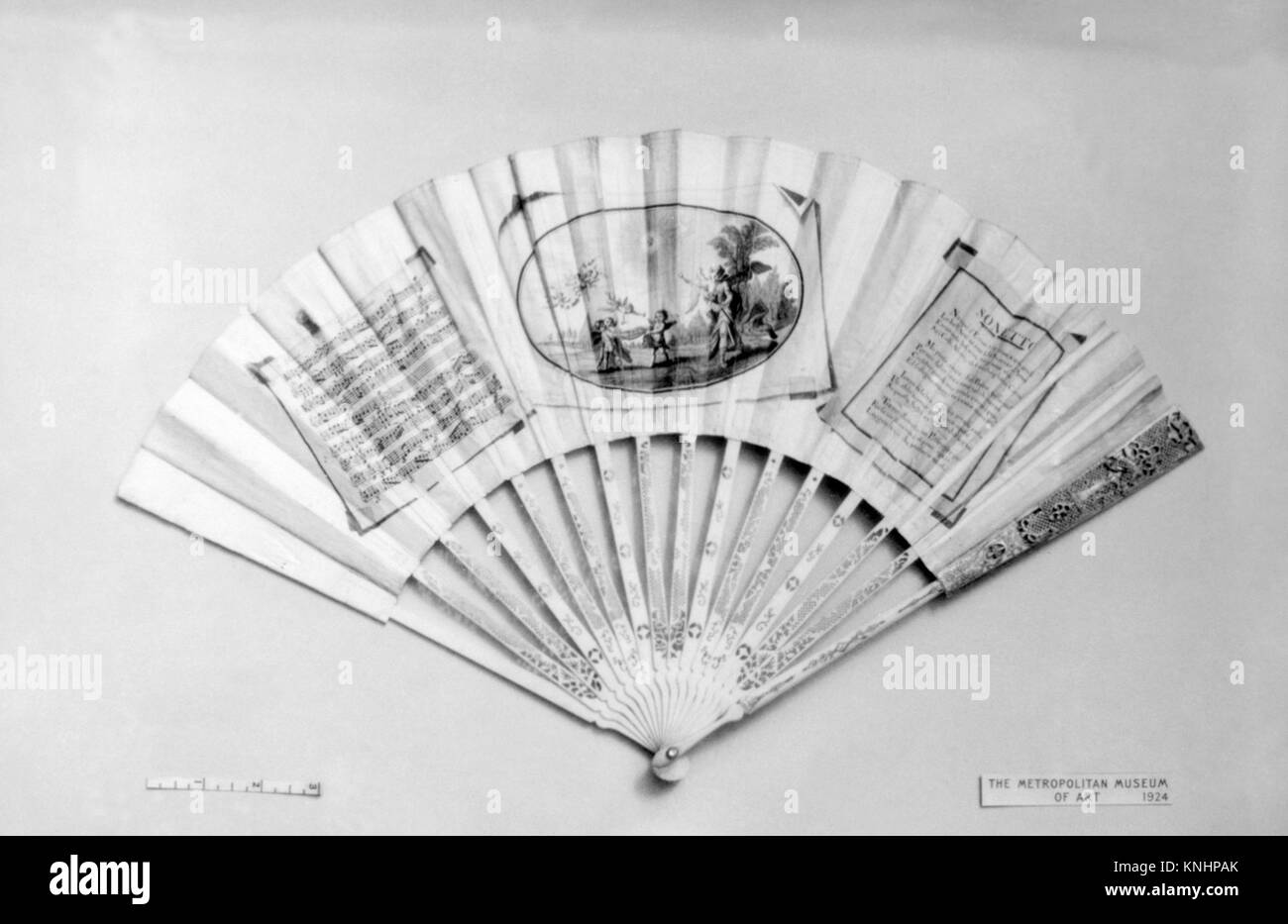 This fan, made from delicate materials, serves both as a functional ...