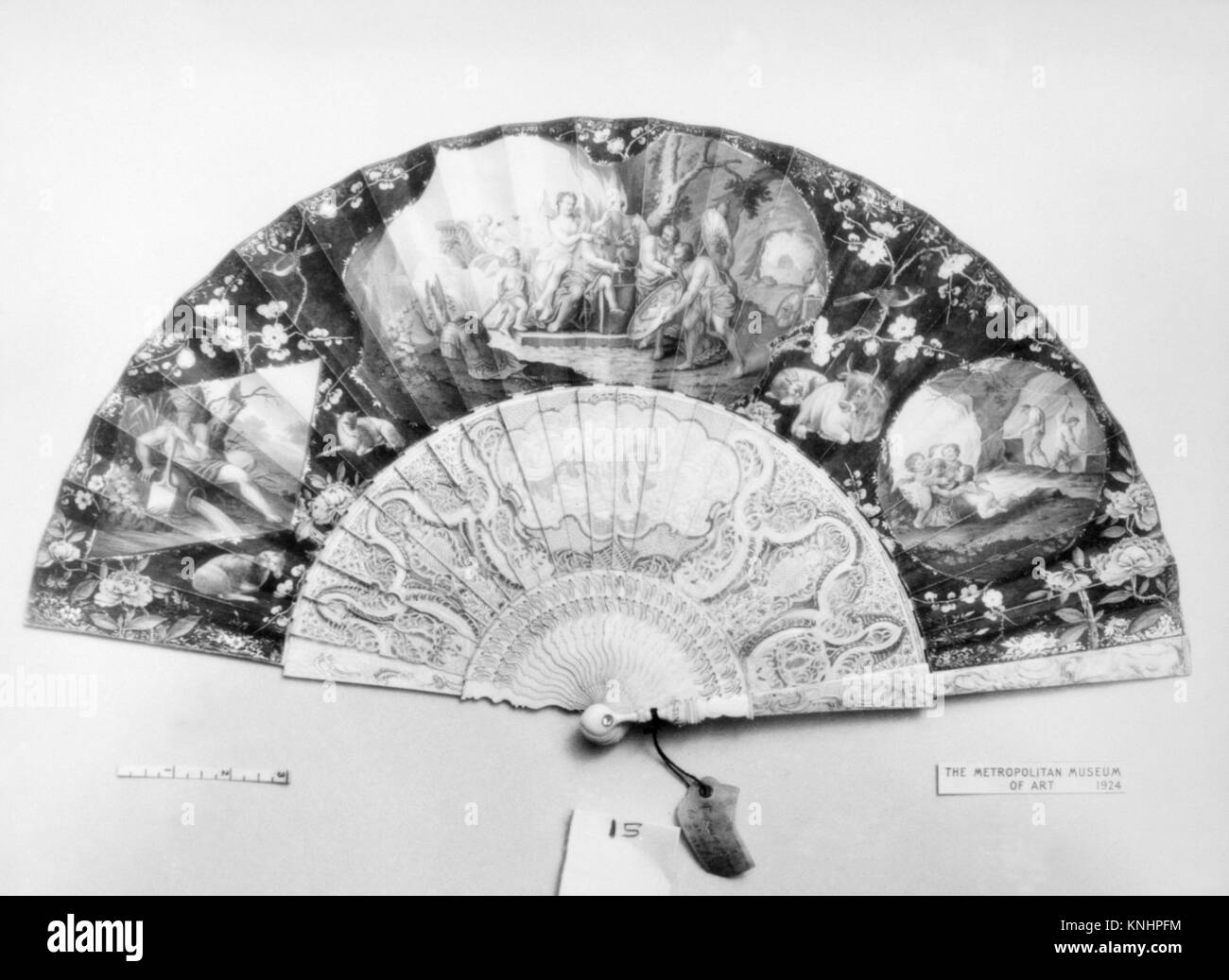 This fan, made with intricate design elements, showcases the ...