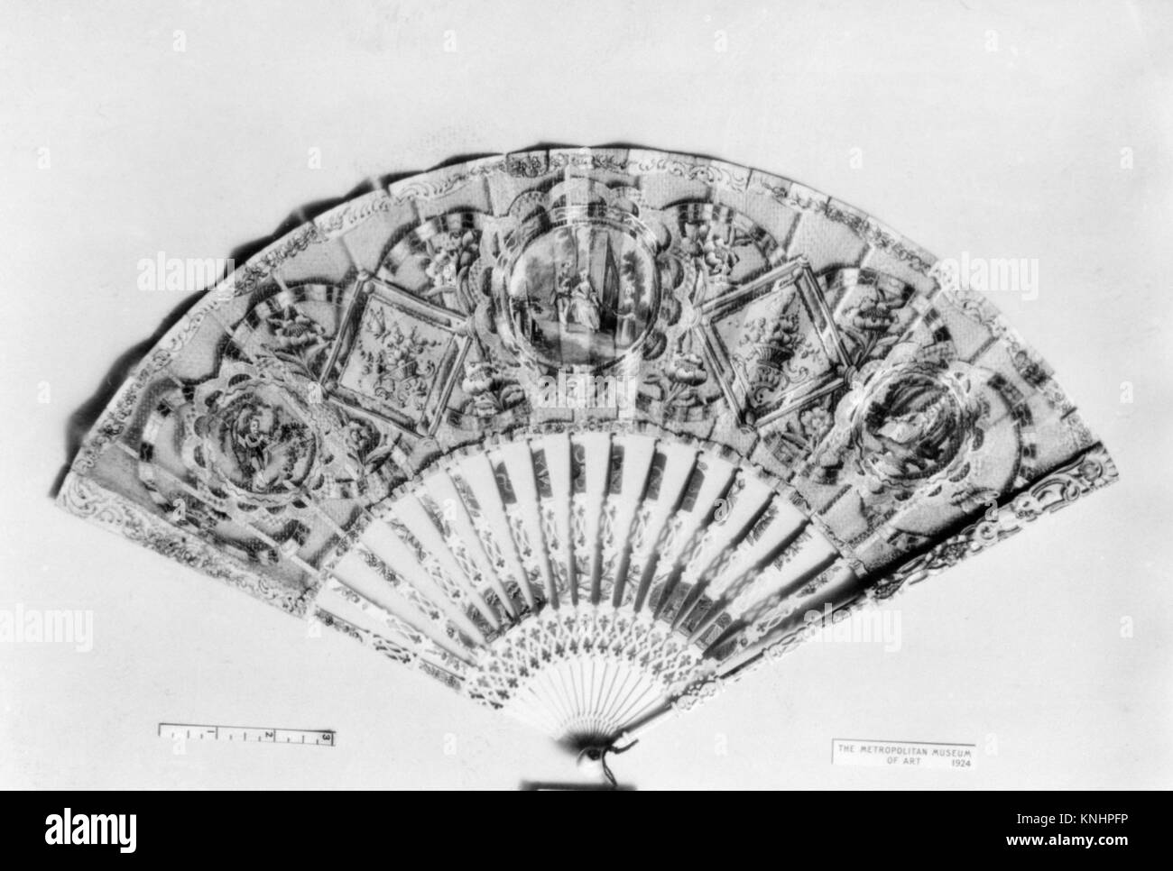 This fan, made of delicate materials, features intricate design ...