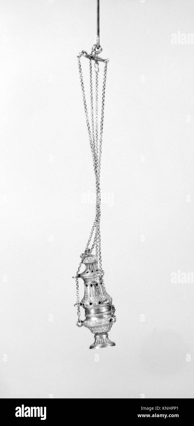 This censer is a metal incense burner used in religious or ceremonial ...