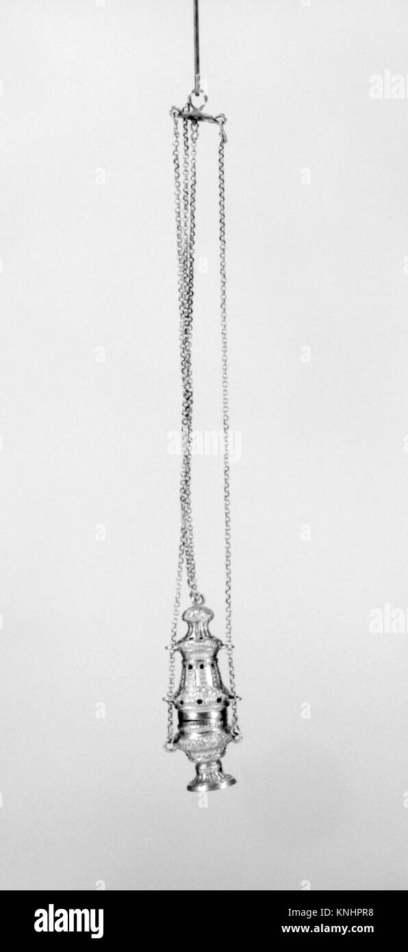 This censer, used for incense burning, features detailed design ...