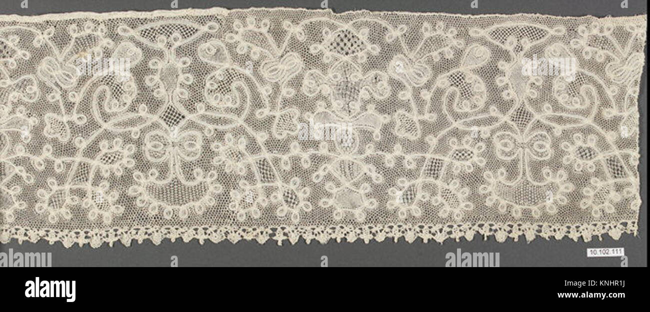 This flounce, made from intricate lace, exemplifies the detailed ...