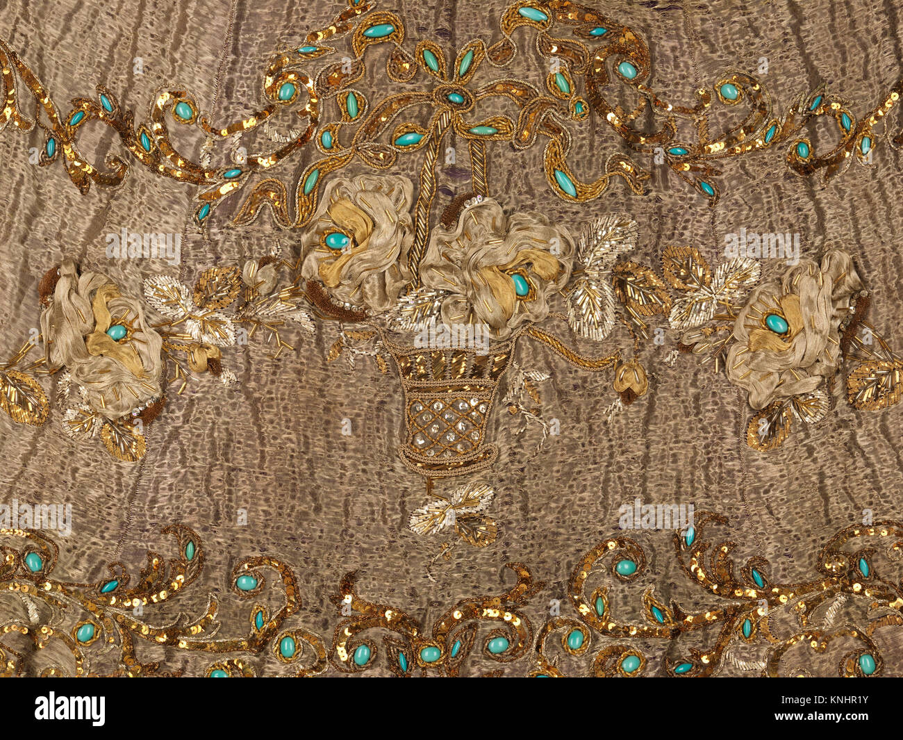 This detailed evening dress, featuring intricate design elements ...