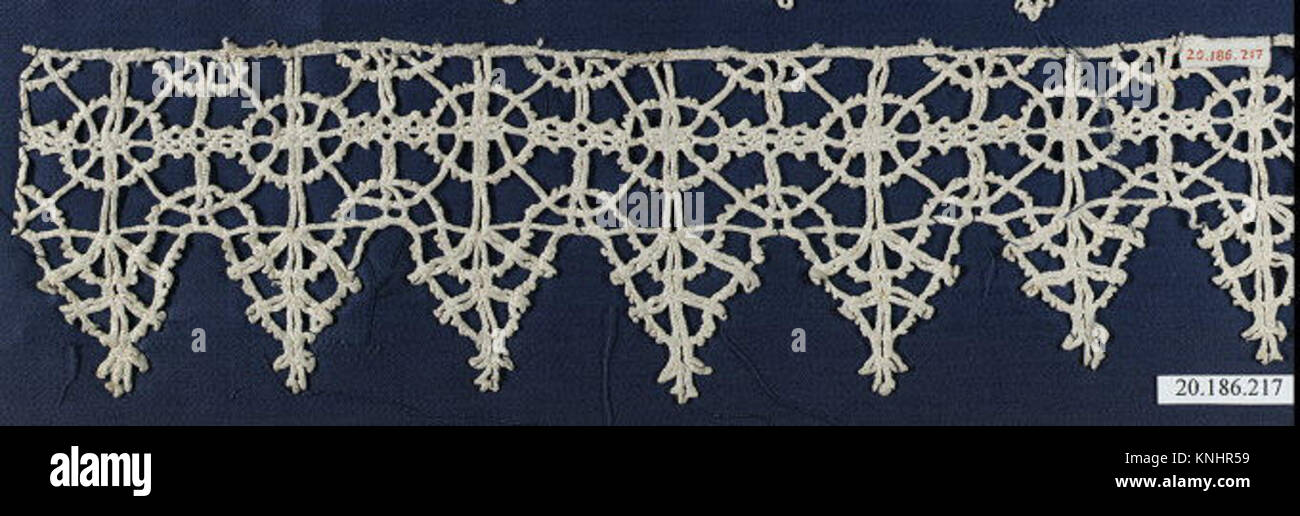 This piece of edging is a fine example of decorative textile work. The ...