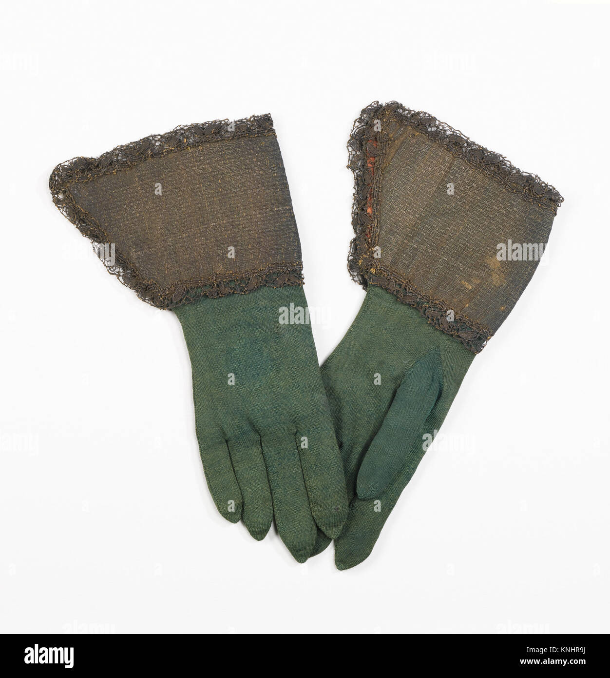 These gauntlets, crafted for protection, are intricately designed ...