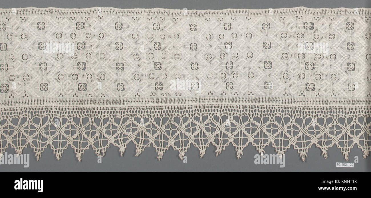 This border, crafted with cutwork and bobbin lace, showcases intricate ...