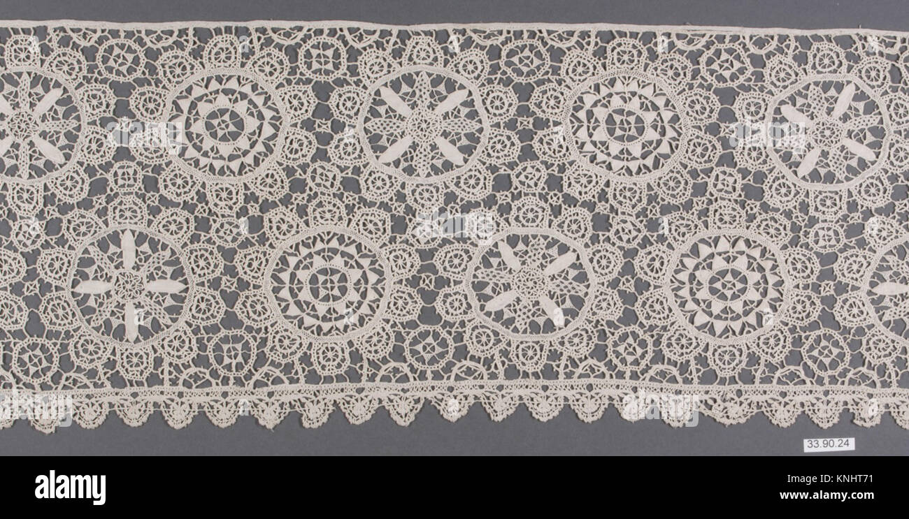 This flounce is a delicate piece of textile, showcasing intricate ...