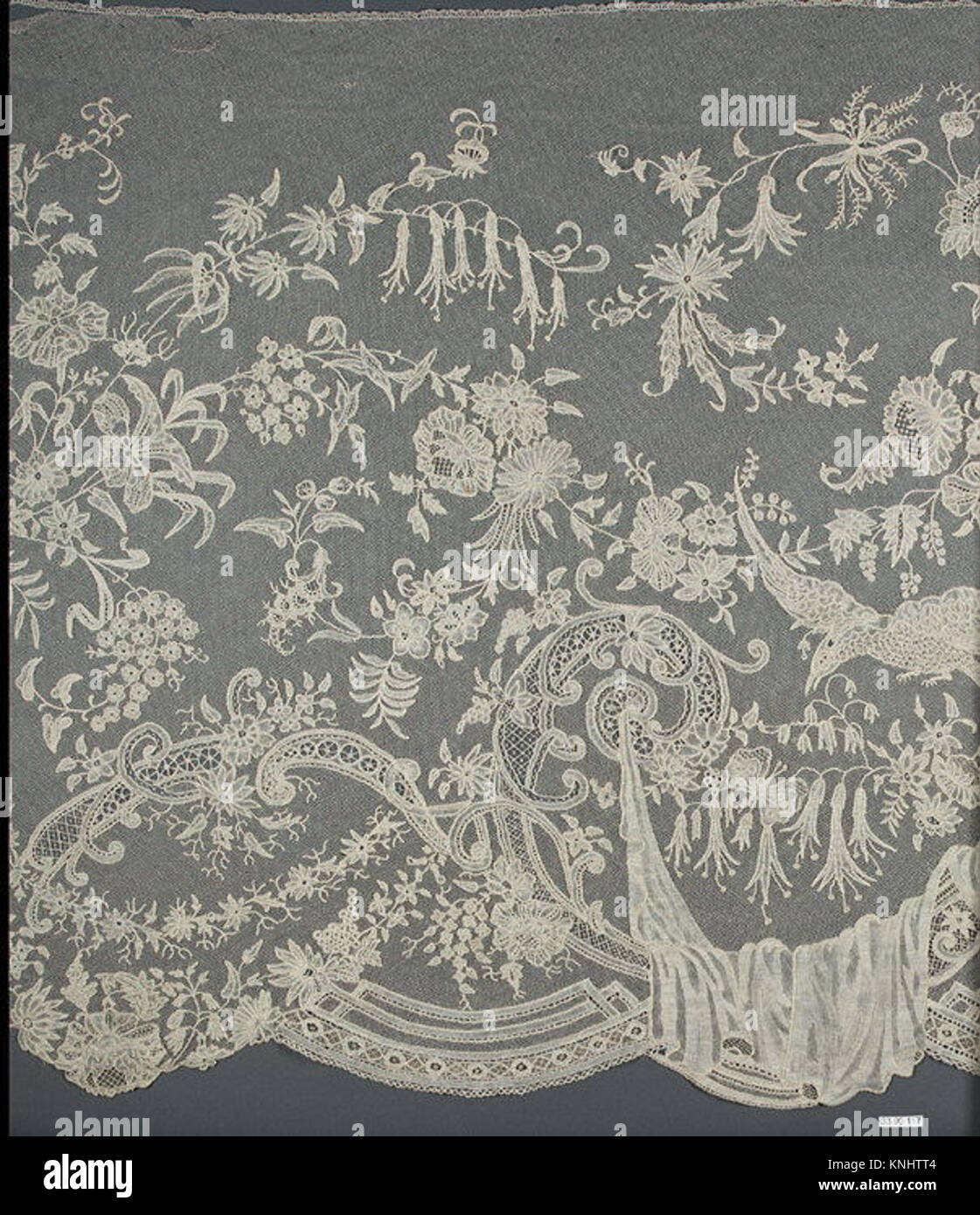 This flounce features delicate fabric work, likely used in fashion or ...