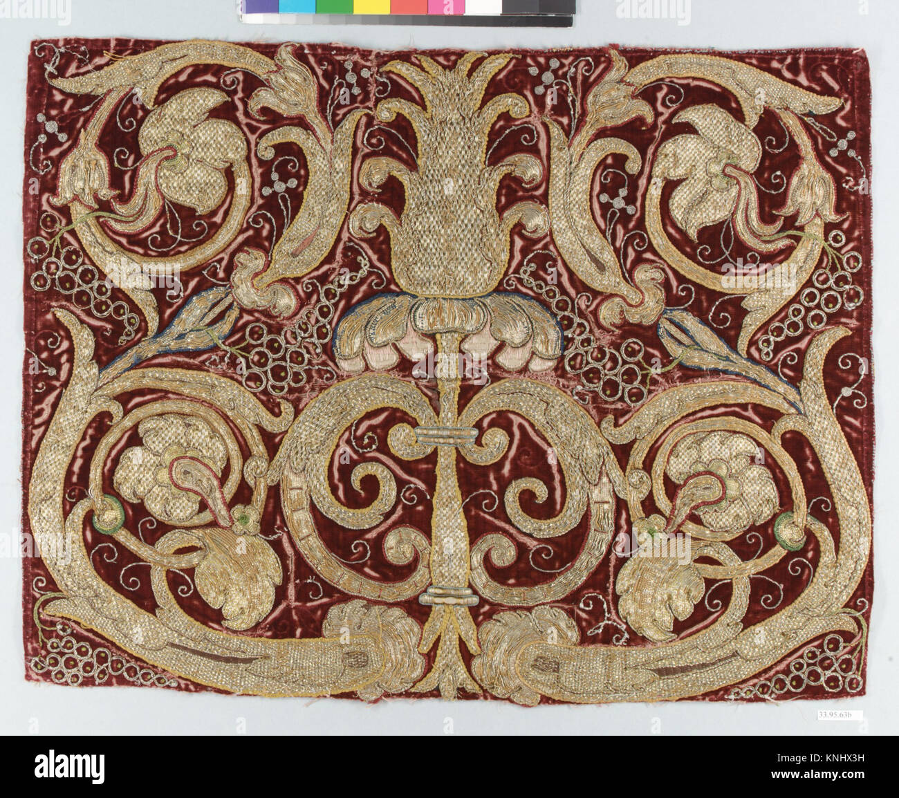 This artwork features golden tendrils set against a vivid red ground ...