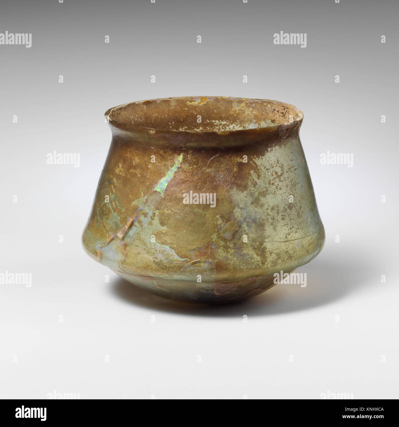 A glass cup identified as MET DP157909, showcasing delicate ...