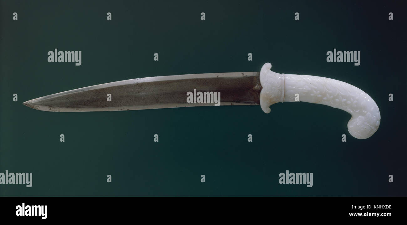 This dagger features a hilt adorned with leafy plant motifs, showcasing the intricate design and ...