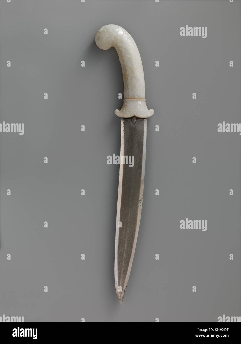 This dagger, with a hilt adorned with leafy plant motifs, is a striking example of weaponry that ...