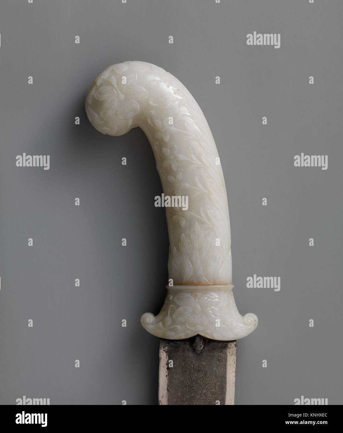 This dagger features a hilt intricately designed with leafy plant motifs, showcasing the ...