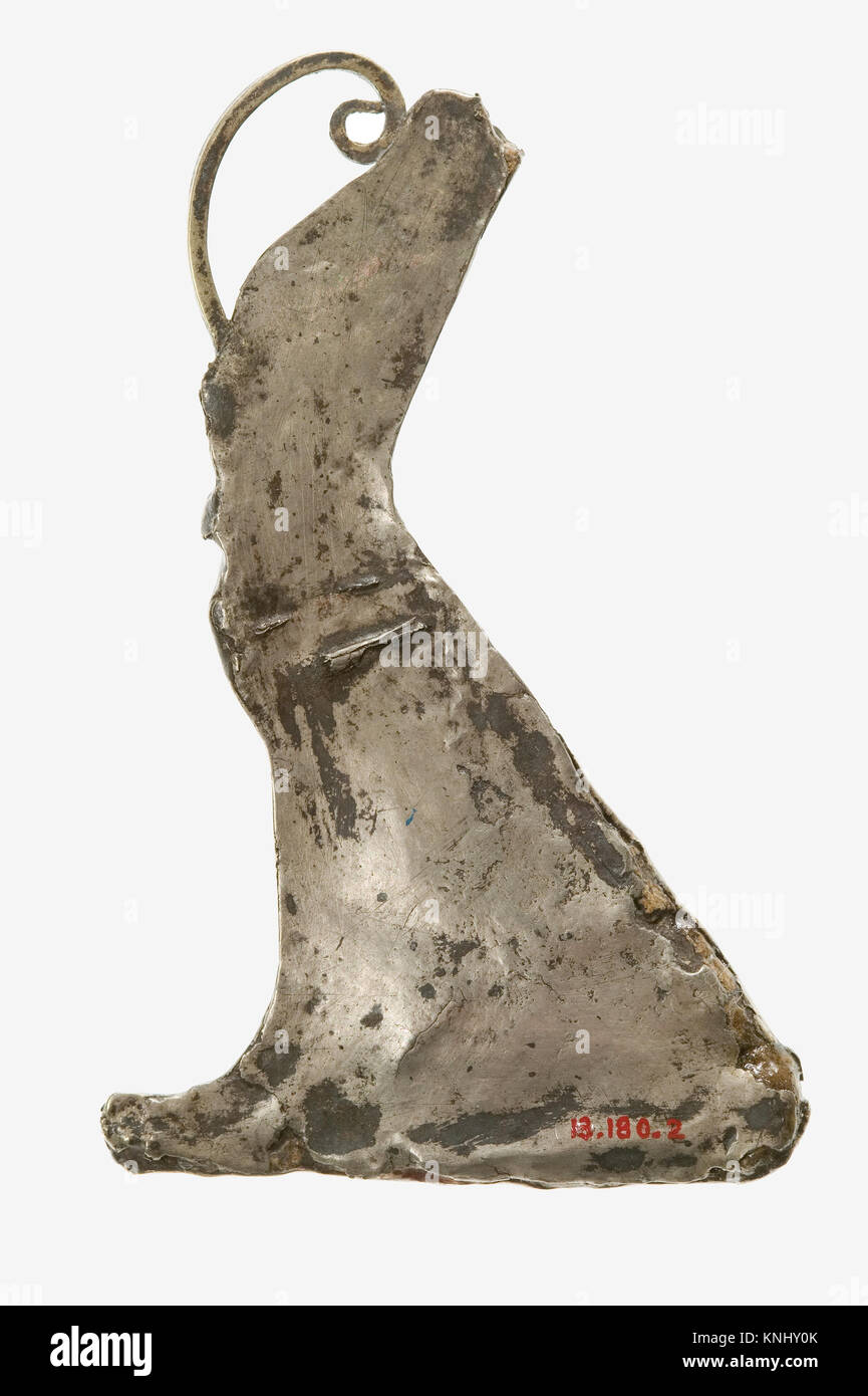 An ancient Egyptian sculpture of a falcon wearing the Double Crown ...