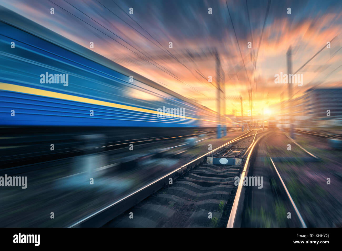 Railway station with motion blur effect. Blurred railroad. Industrial ...