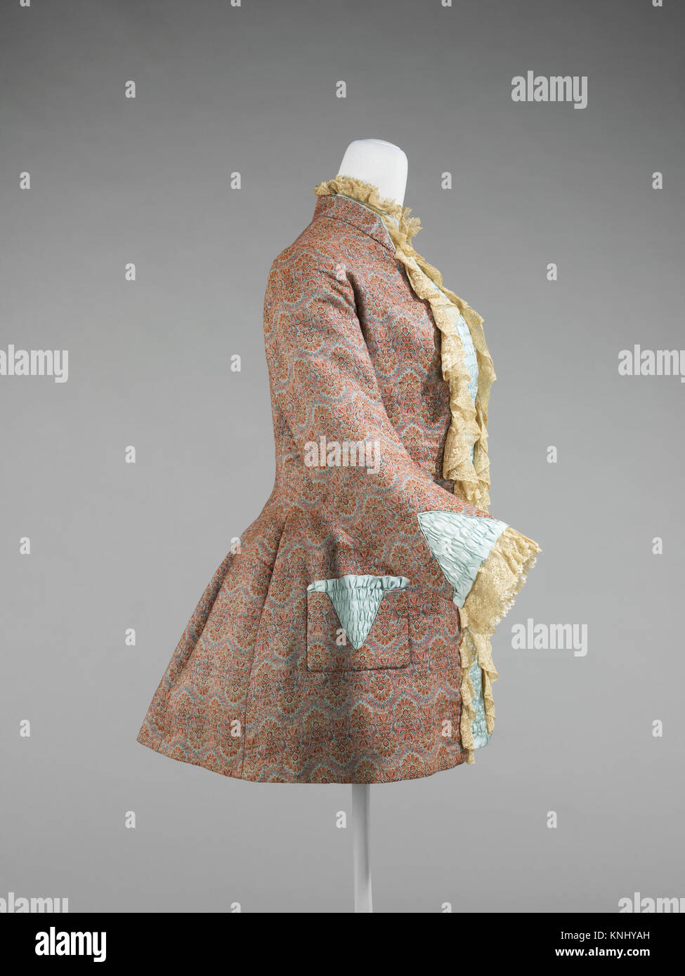 This historical dressing jacket is an antique garment showcasing period ...