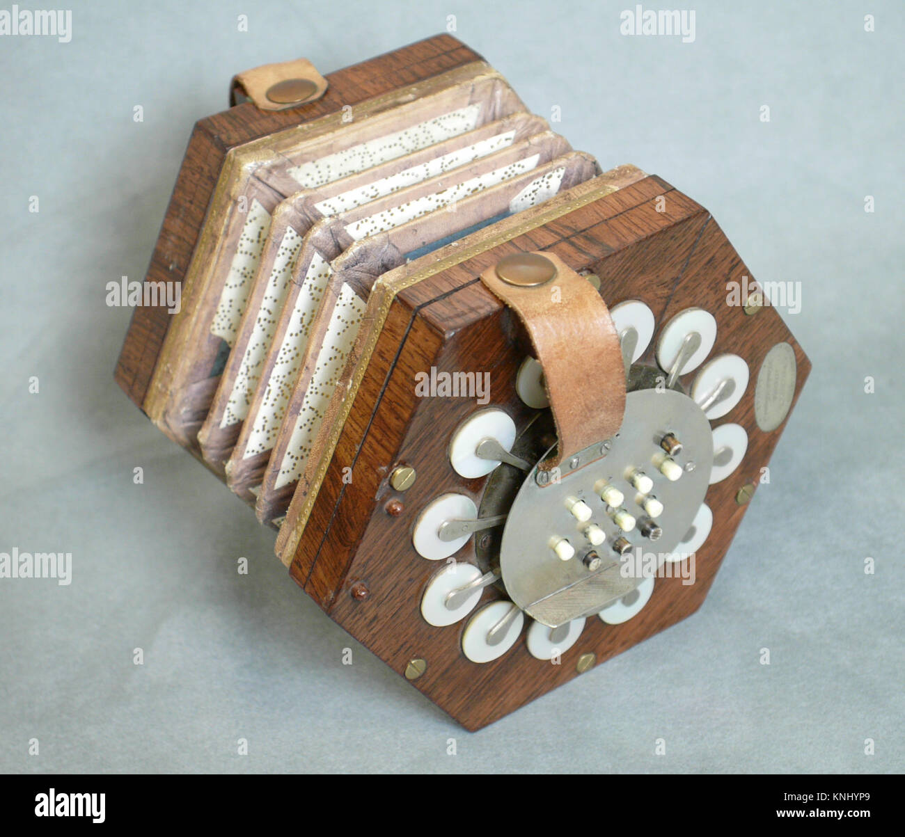 This concertina, a type of small accordion, is an early example of the ...