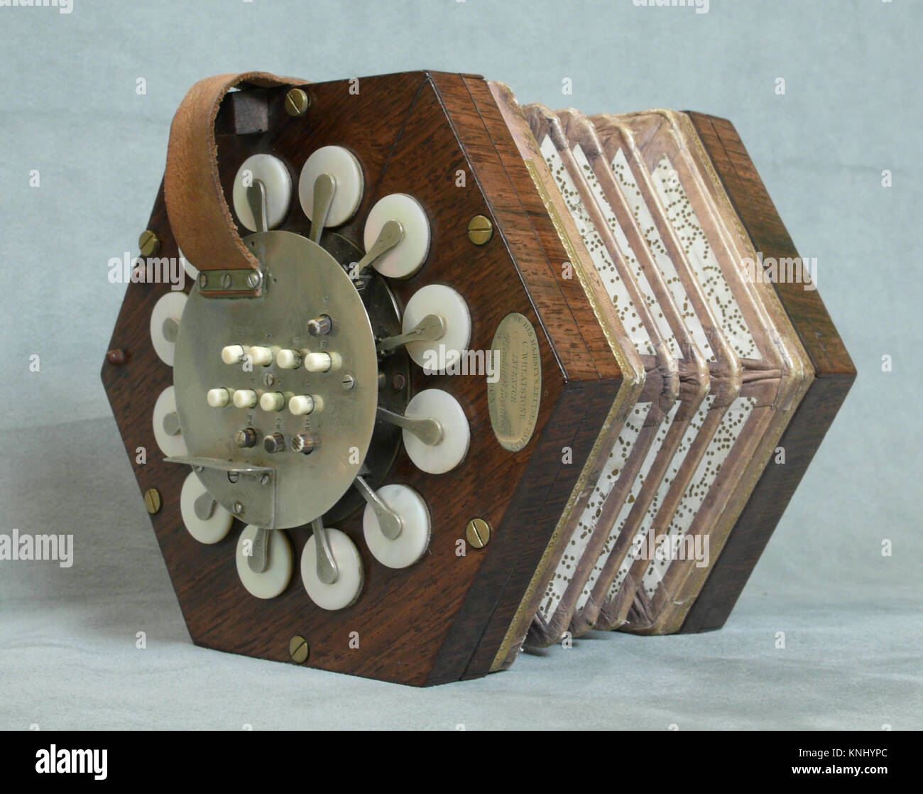 This concertina, a type of small accordion, is a musical instrument ...
