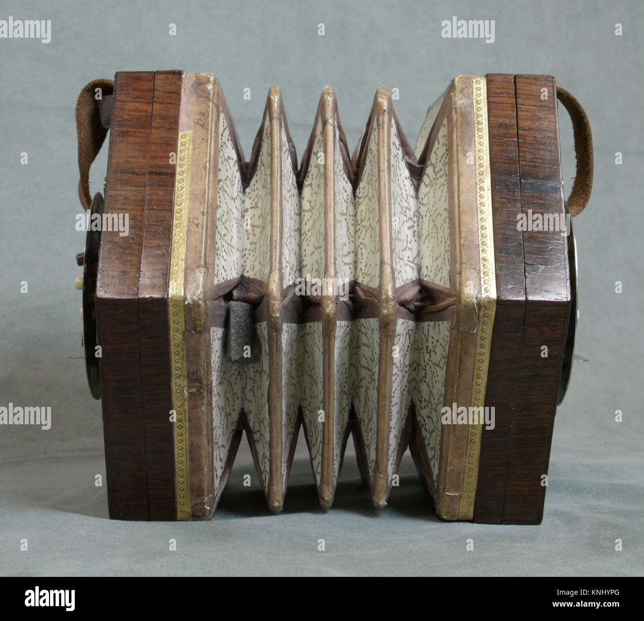 A concertina, a small, portable musical instrument, showcasing the ...