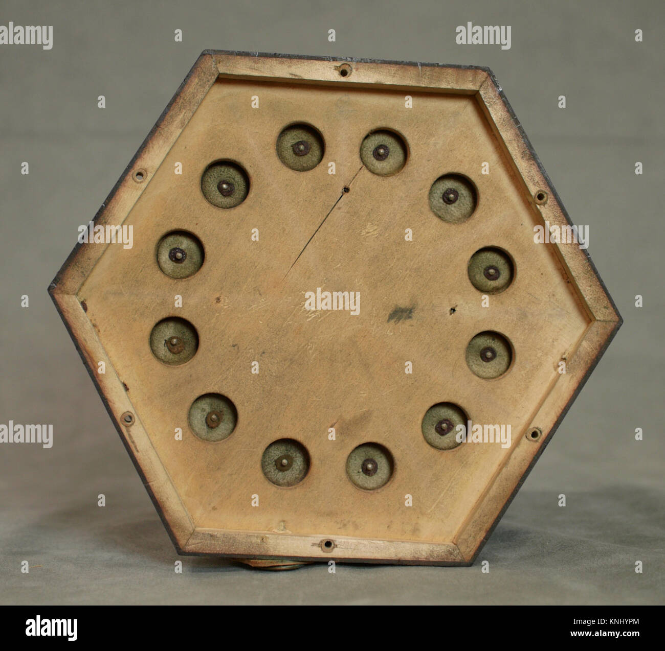 This concertina, a type of portable musical instrument, features a ...