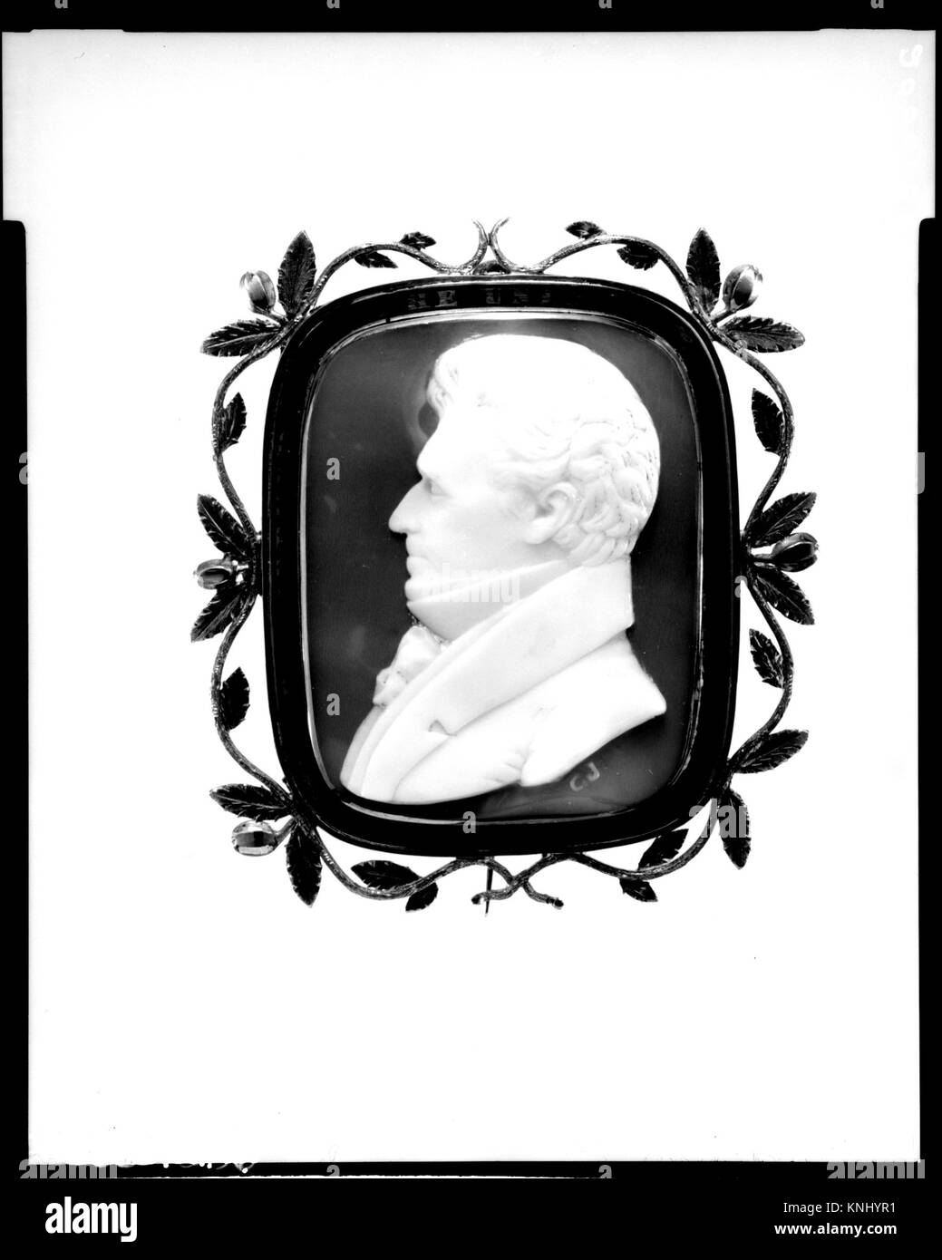Classical cameo with engraved relief showing detailed portraiture ...