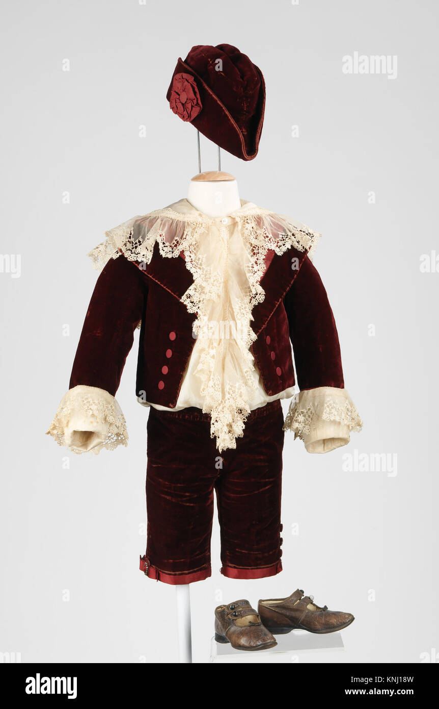 This ensemble consists of multiple garments and accessories that ...