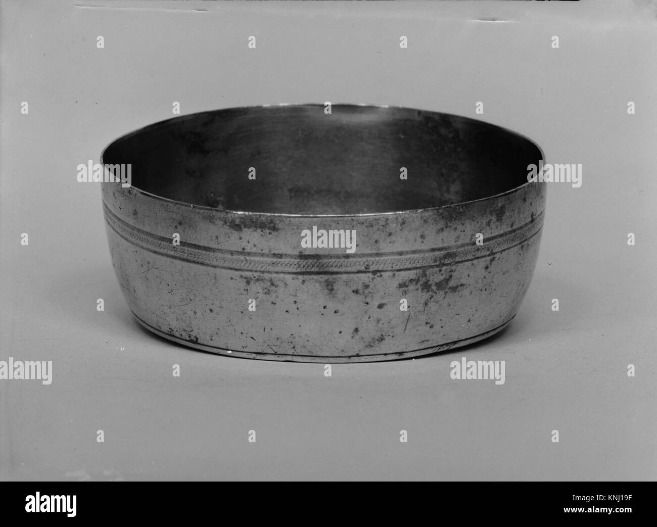 This coaster, made from pewter, dates between 1832 and 1839. It was ...